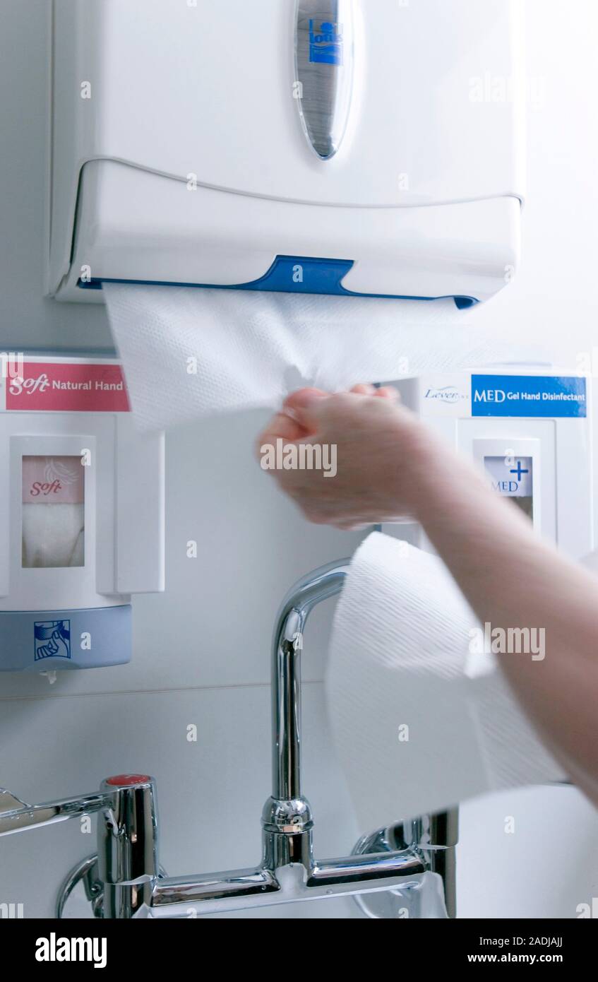 Hand drying. Hospital worker drying their hands Stock Photo - Alamy