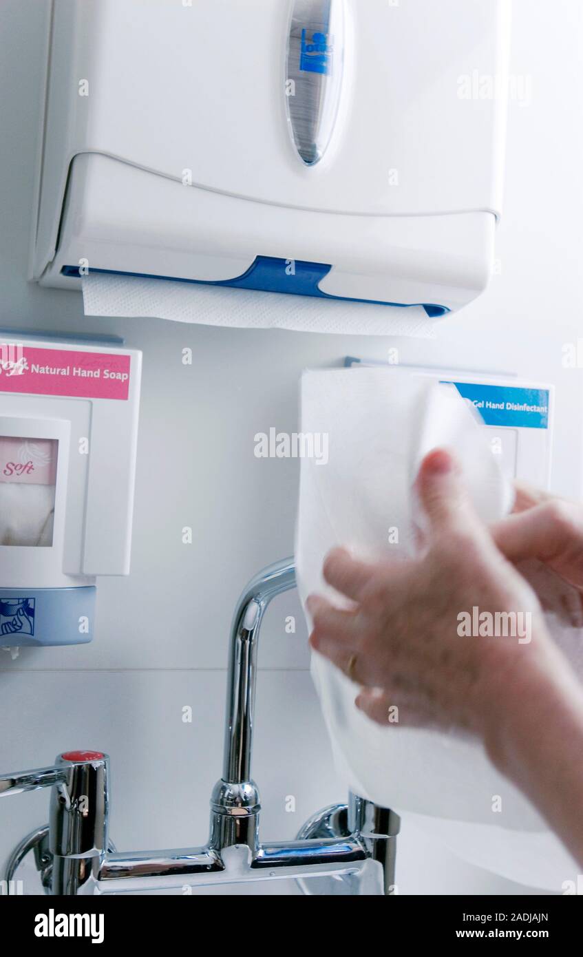 Hand drying. Hospital worker drying their hands Stock Photo - Alamy