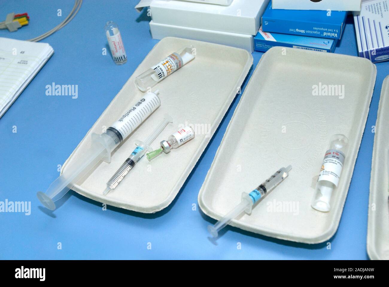 Anaesthetic drugs. Tray in an operating theatre containing anaesthetic ...