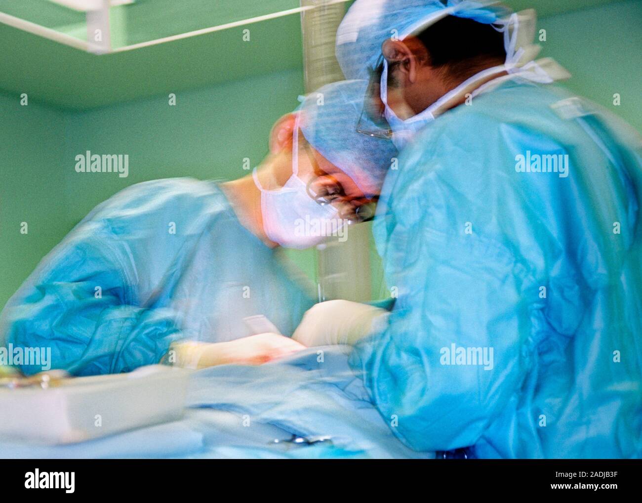 Heart surgery. Surgeons performing coronary bypass surgery. The surgeon ...