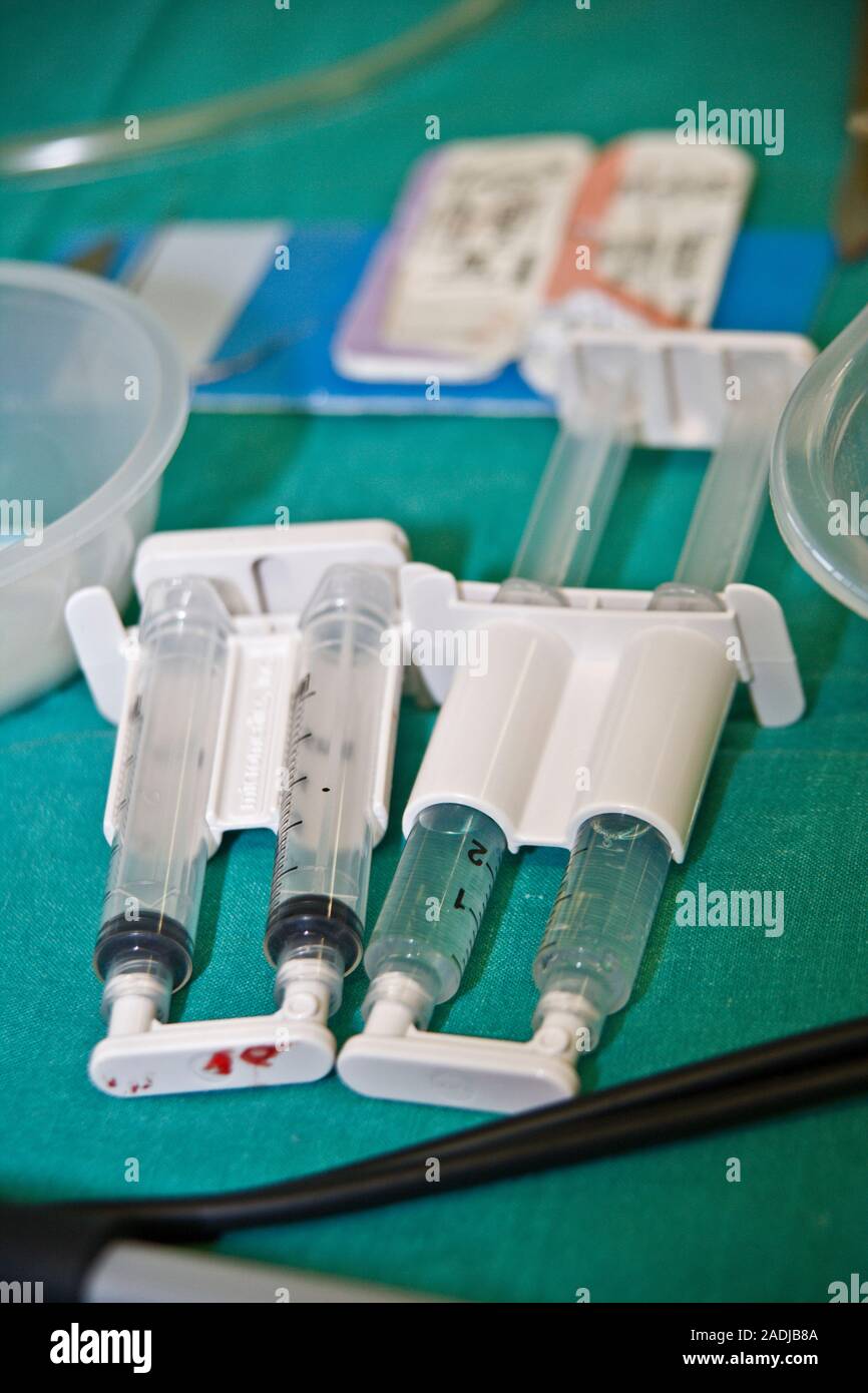 Fibrinogen surgical sealant. Two sets of syringes of fibrinogen sealant ...