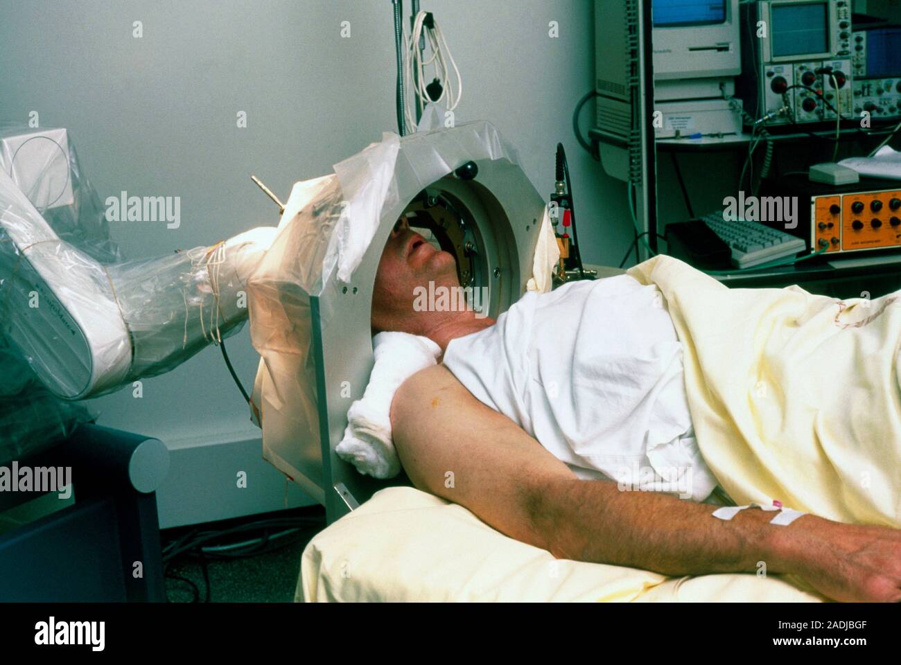 Robotic brain surgery. NeuroMate robot (at left) operates on the brain ...