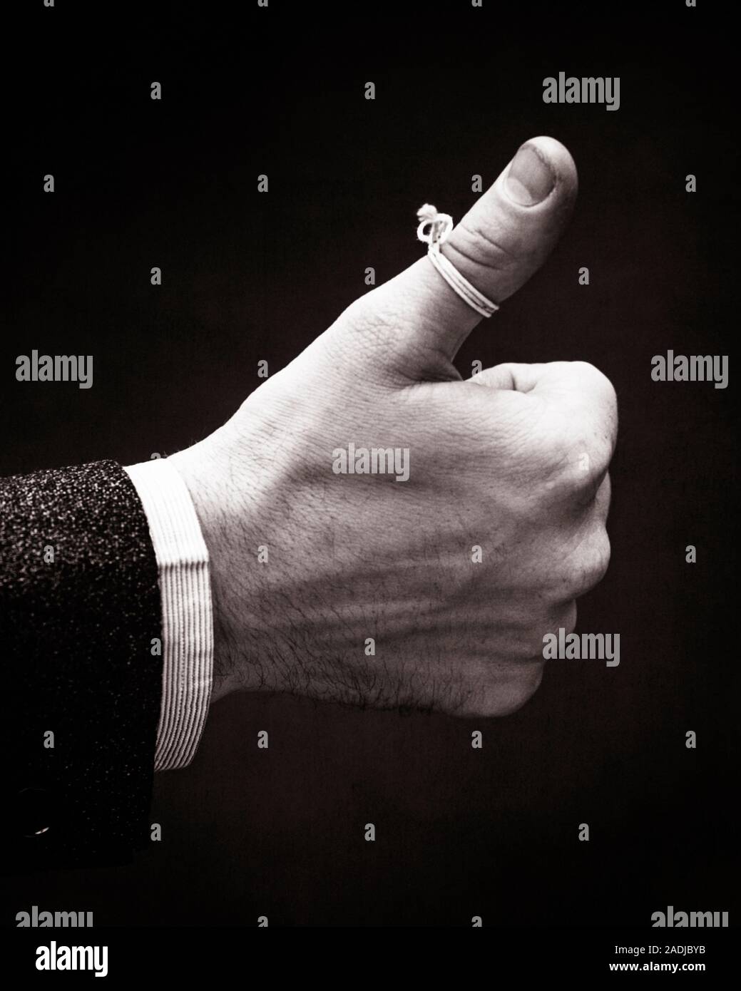 Man hands tied string symbol hi-res stock photography and images - Alamy