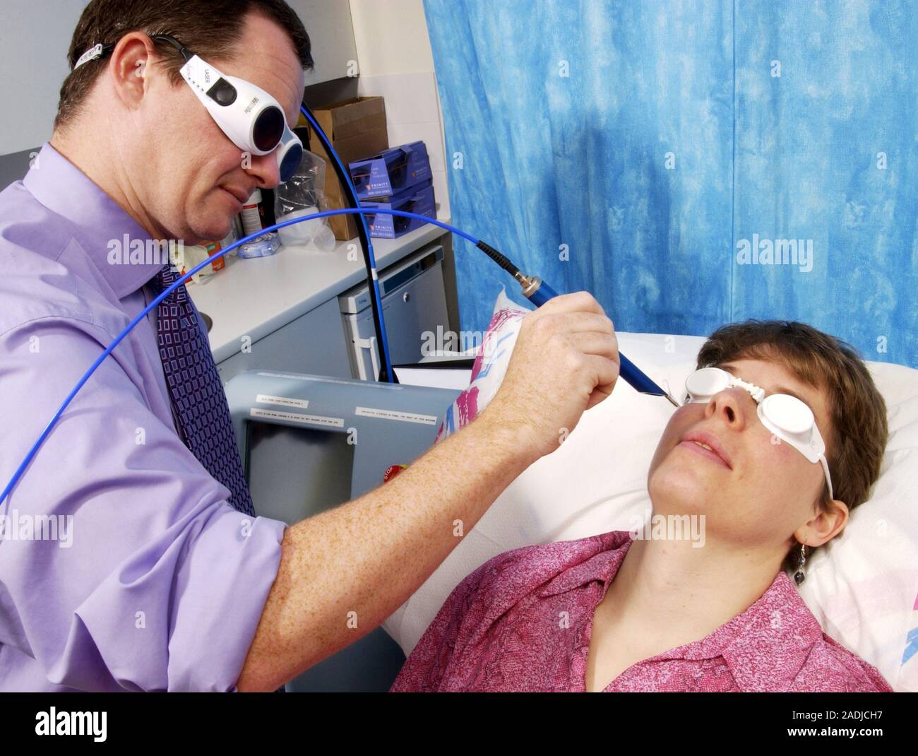 MODEL RELEASED. Laser skin treatment. Doctor using a laser on the skin ...