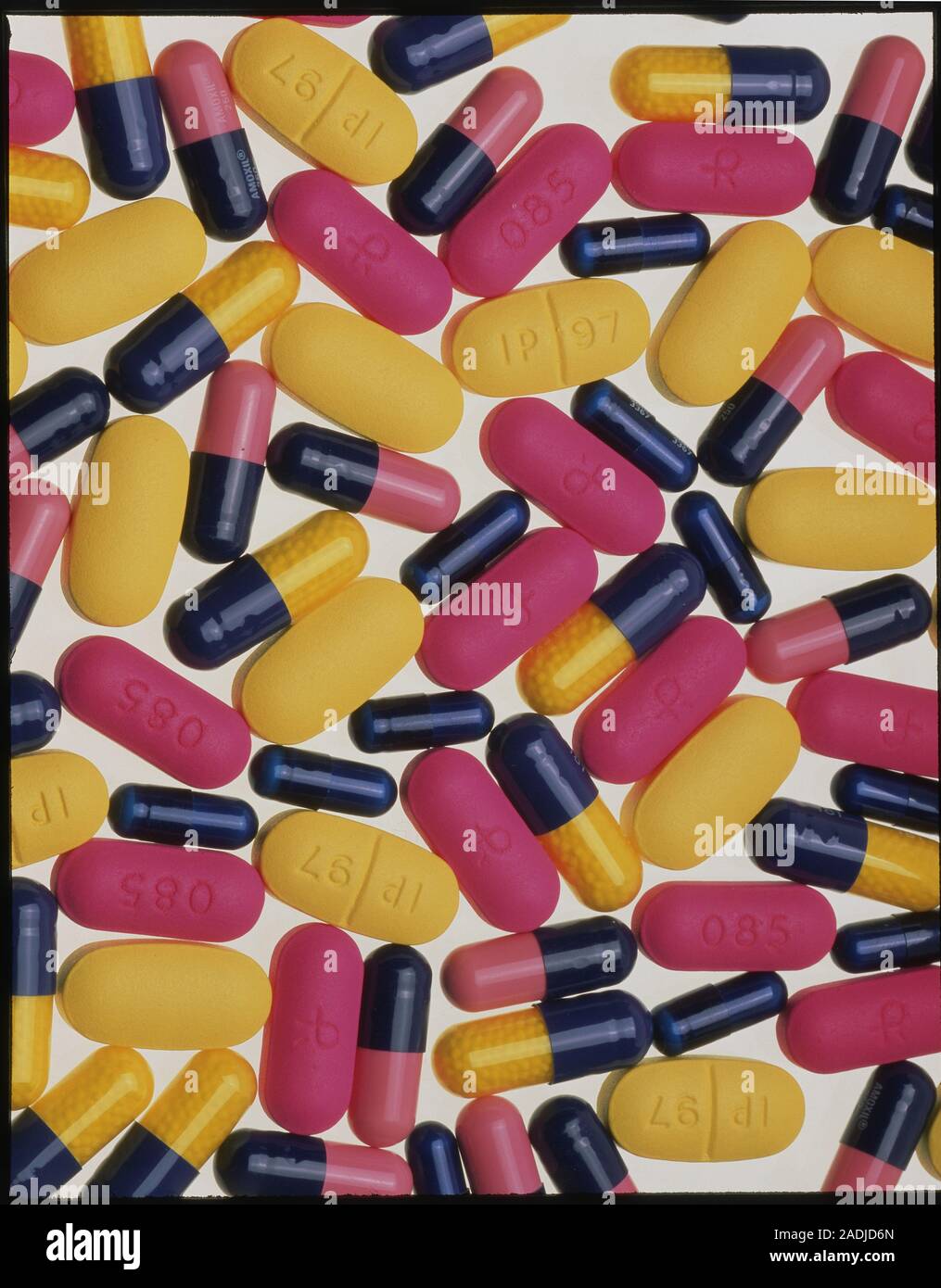 Prescription drugs. Coloured assortment of medical pills, tablets and ...