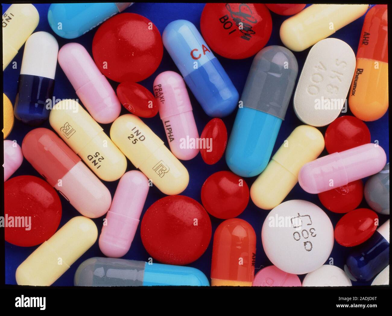 Prescription drugs. Coloured assortment of medical pills, tablets and ...