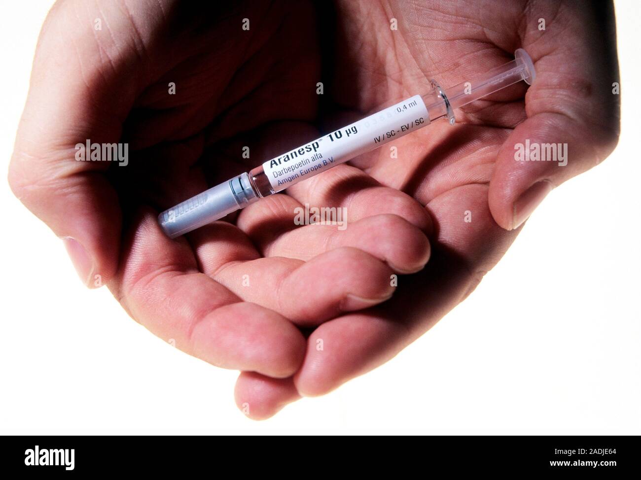 Aranesp anaemia drug. Hand holding a syringe containing a 10 microgram ...