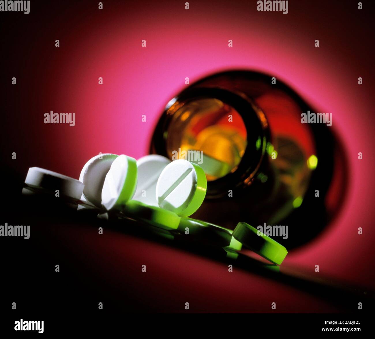 Painkiller drug. Bottle of spilled pills of a common analgesic ...