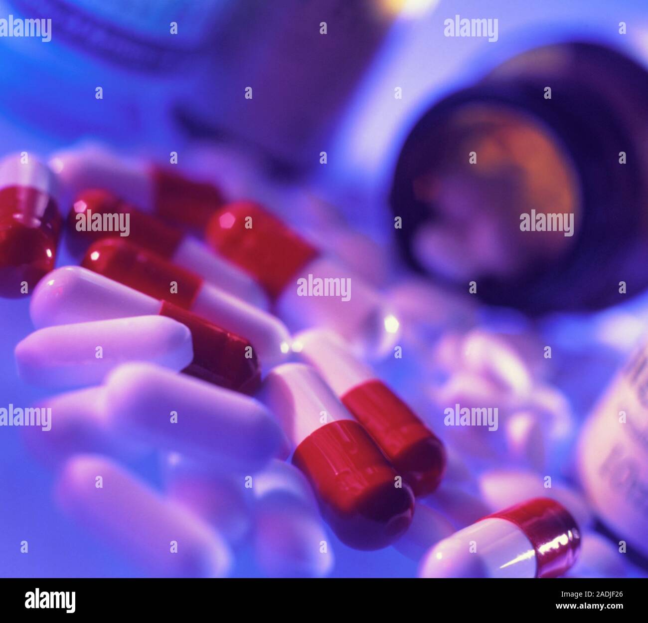 Painkillers. Painkilling drugs lying next to bottles. Aspirin tablets ...