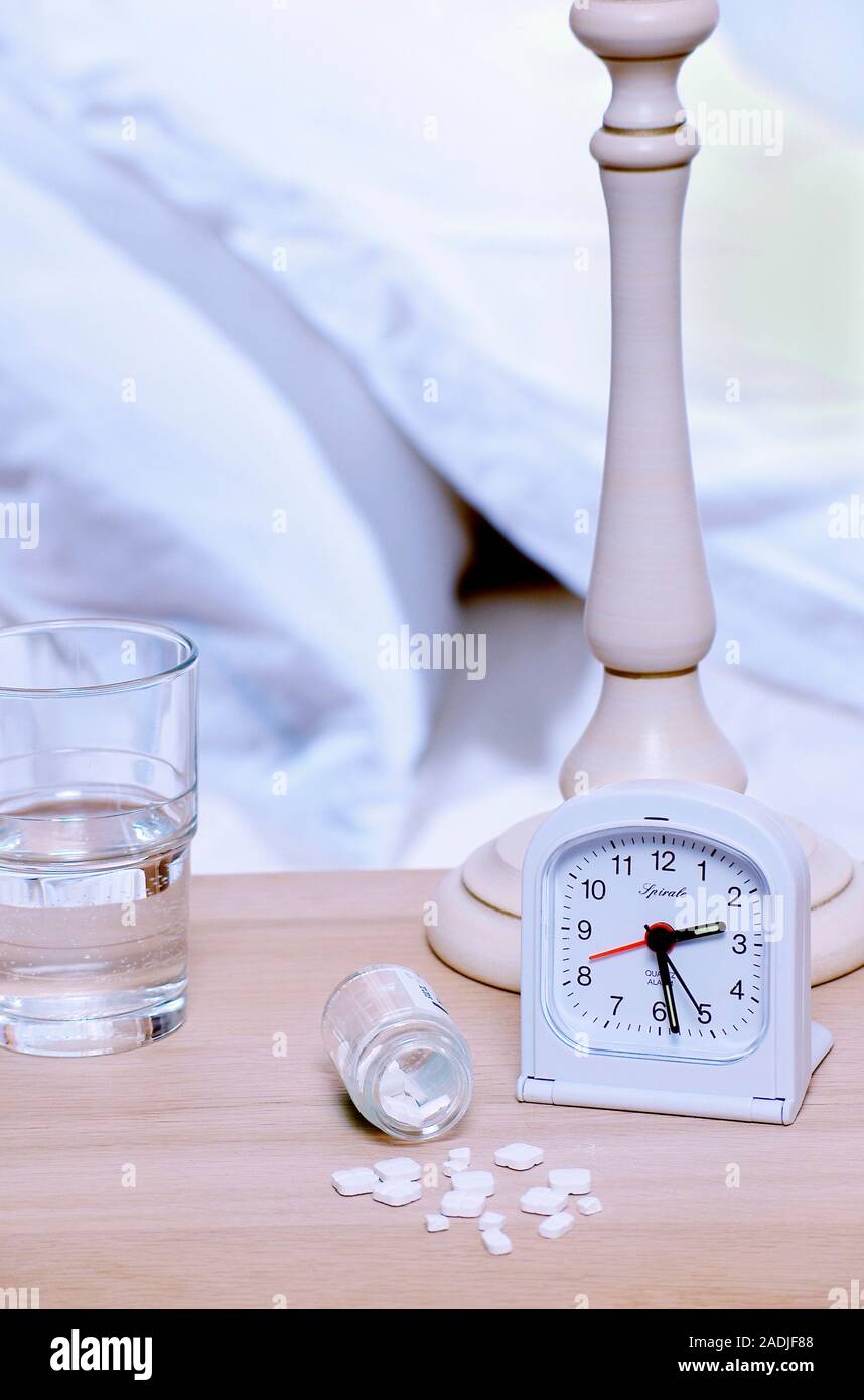 Sleeping pills on a bedside table Stock Photo - Alamy
