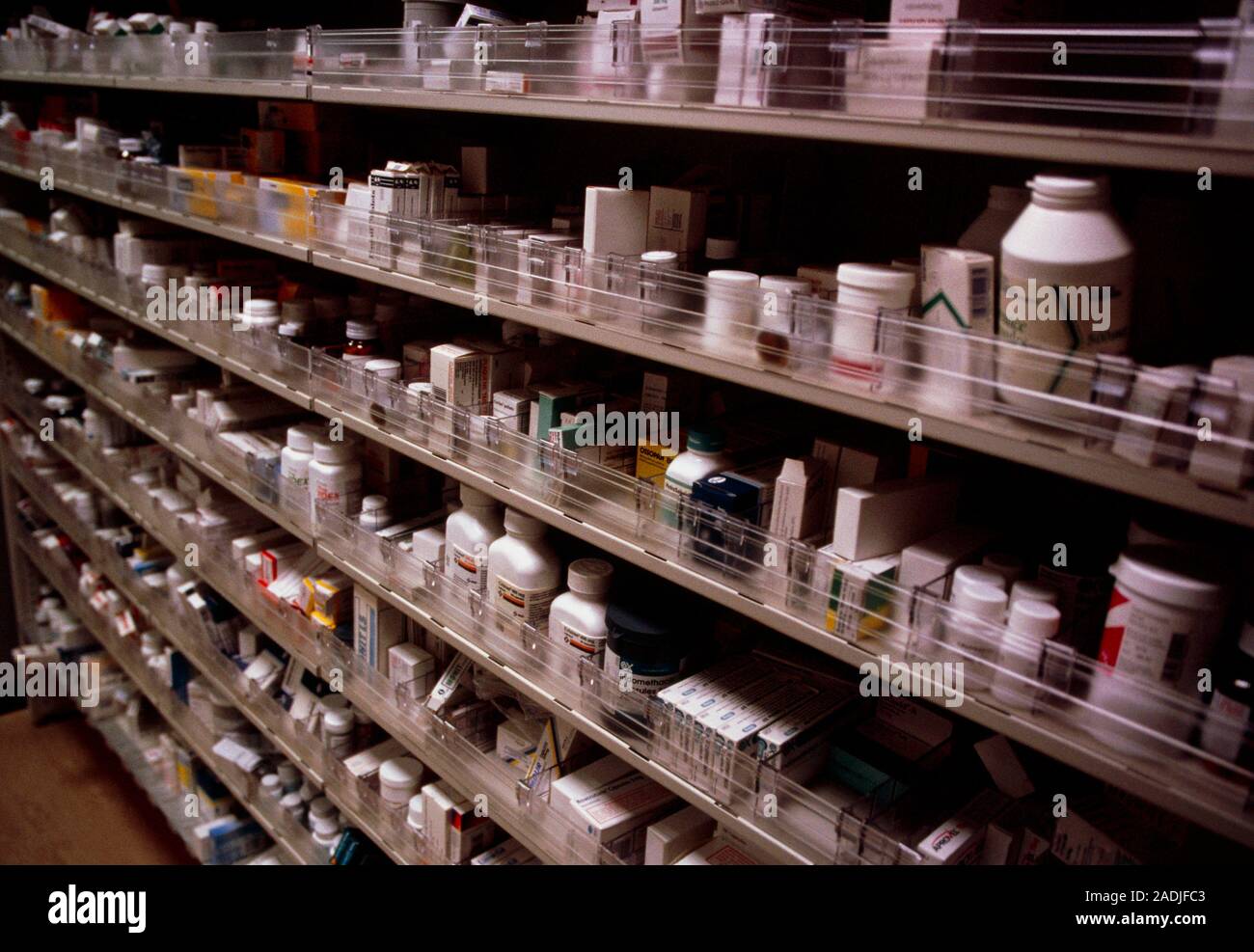 Pharmacy. Shelves containing bottled and packaged prescription ...
