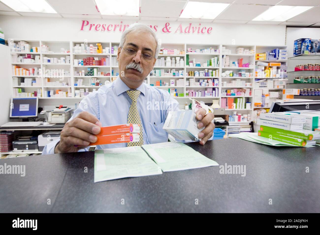 Pharmacist at work filling a prescription Stock Photo - Alamy