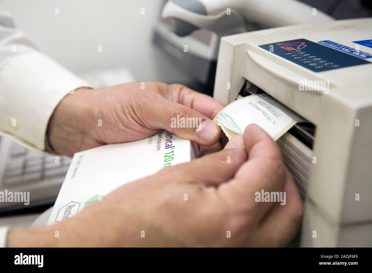 Pharmacist printing out instructions for a medication Stock Photo - Alamy