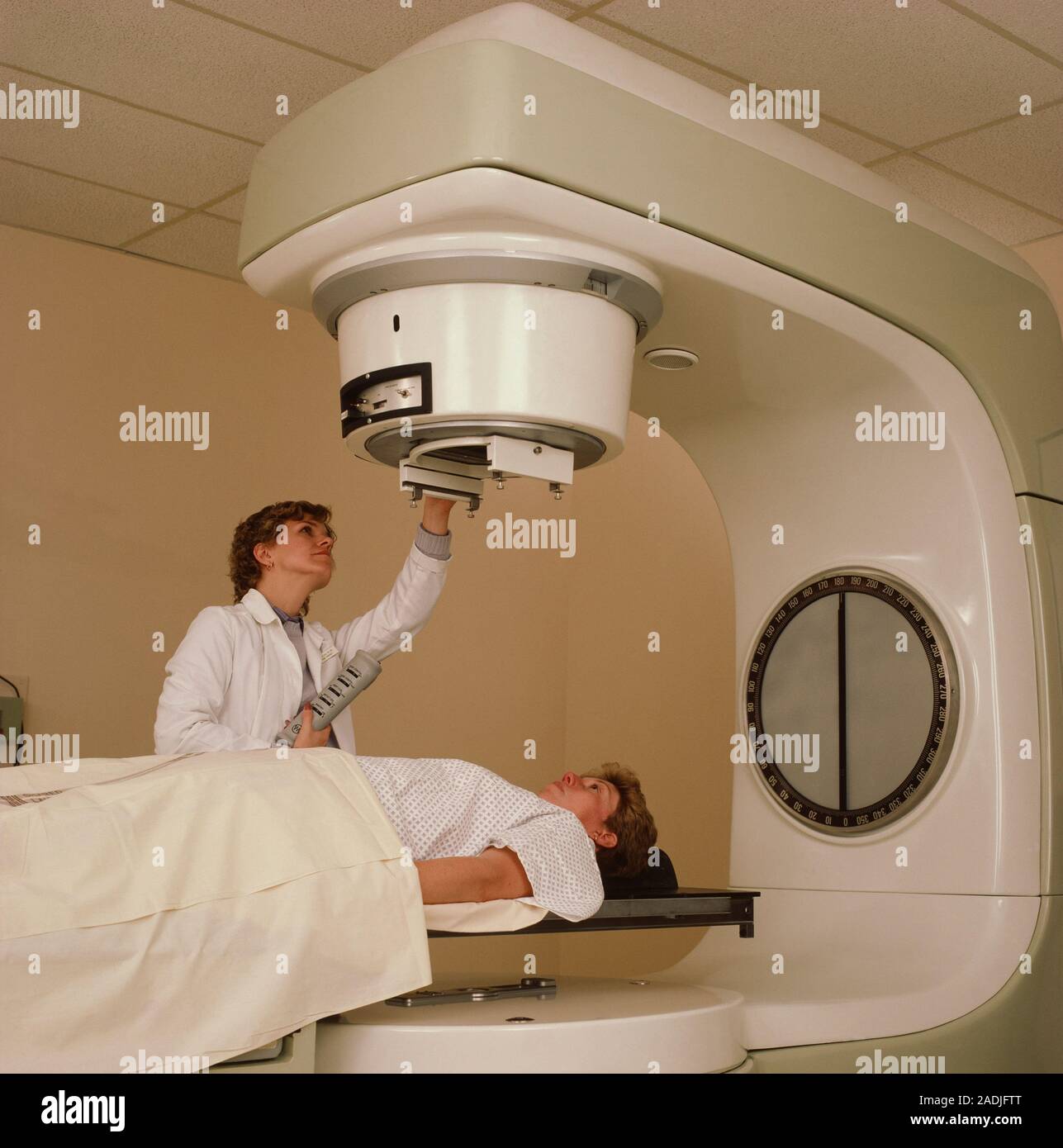 Person undergoing radiotherapy (radiation treatment) on a linear ...