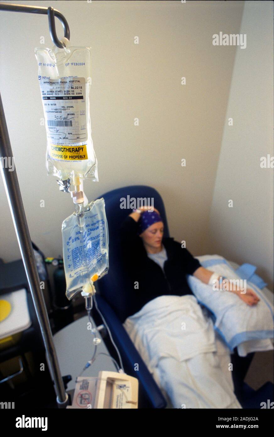 Cancer chemotherapy. Female patient receiving anticancer drugs from an ...