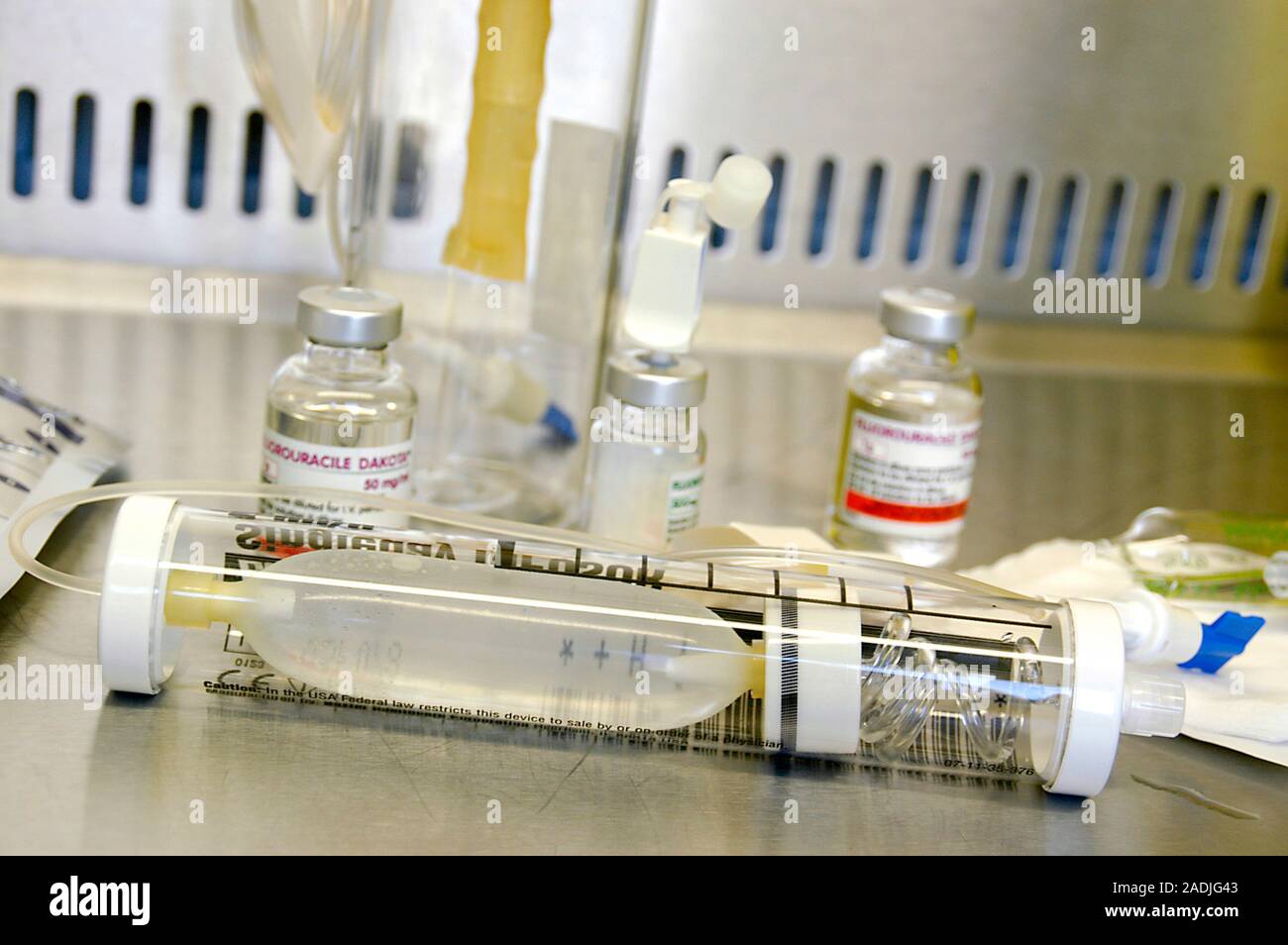 Chemotherapy equipment and drugs. Vials of cancer drugs with a cancer ...