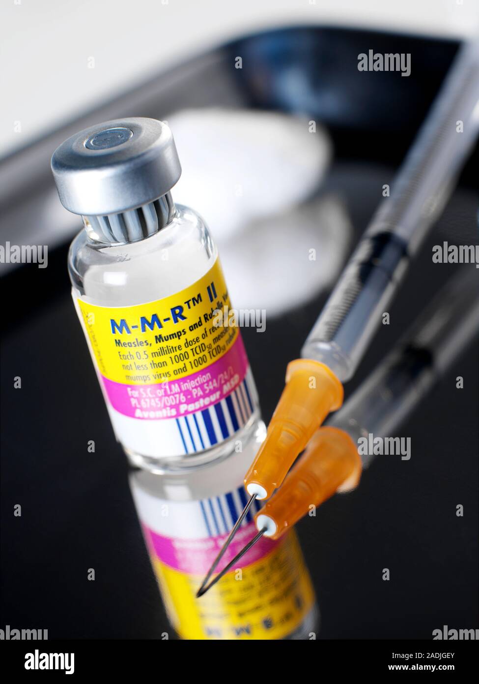 MMR vaccine in a vial, with a syringe. This combined vaccine protects ...