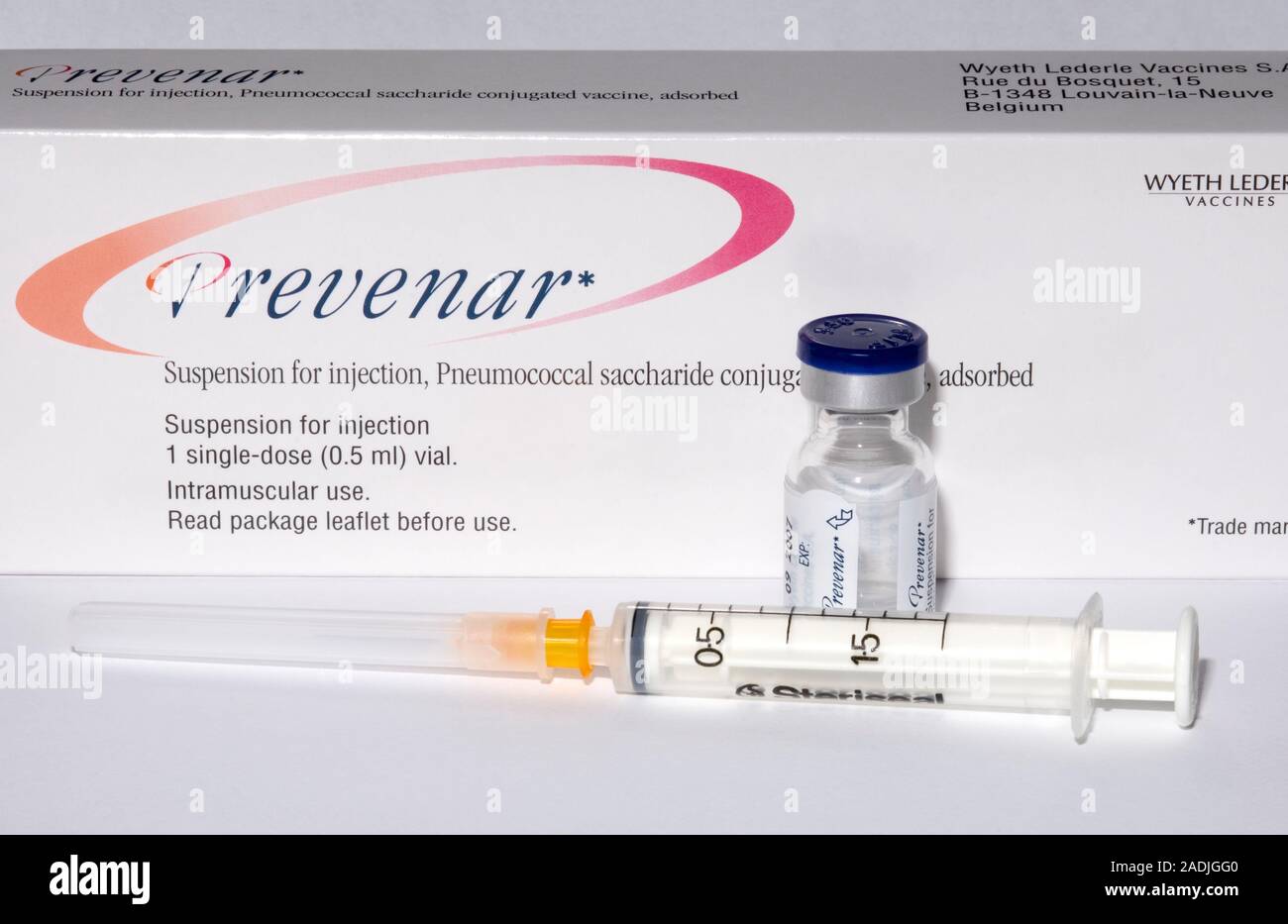 Streptococcus vaccine. Hypodermic syringe in front of a phial and ...