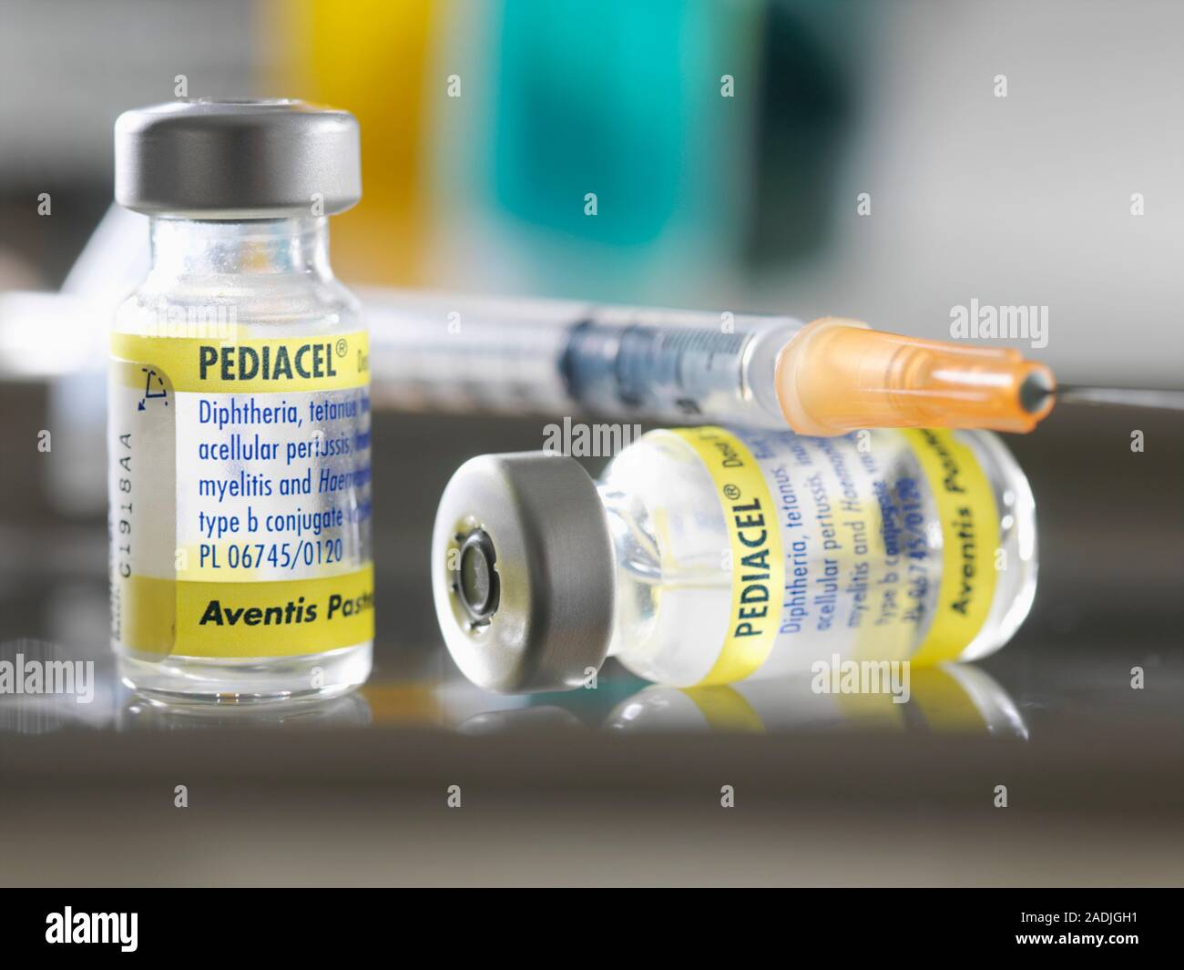 Pediacel vaccine. Syringe and vials on a counter. This combination ...
