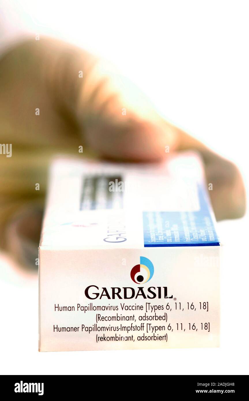 Human papillomavirus vaccine. Hand holding a Gardasil vaccine box. This ...