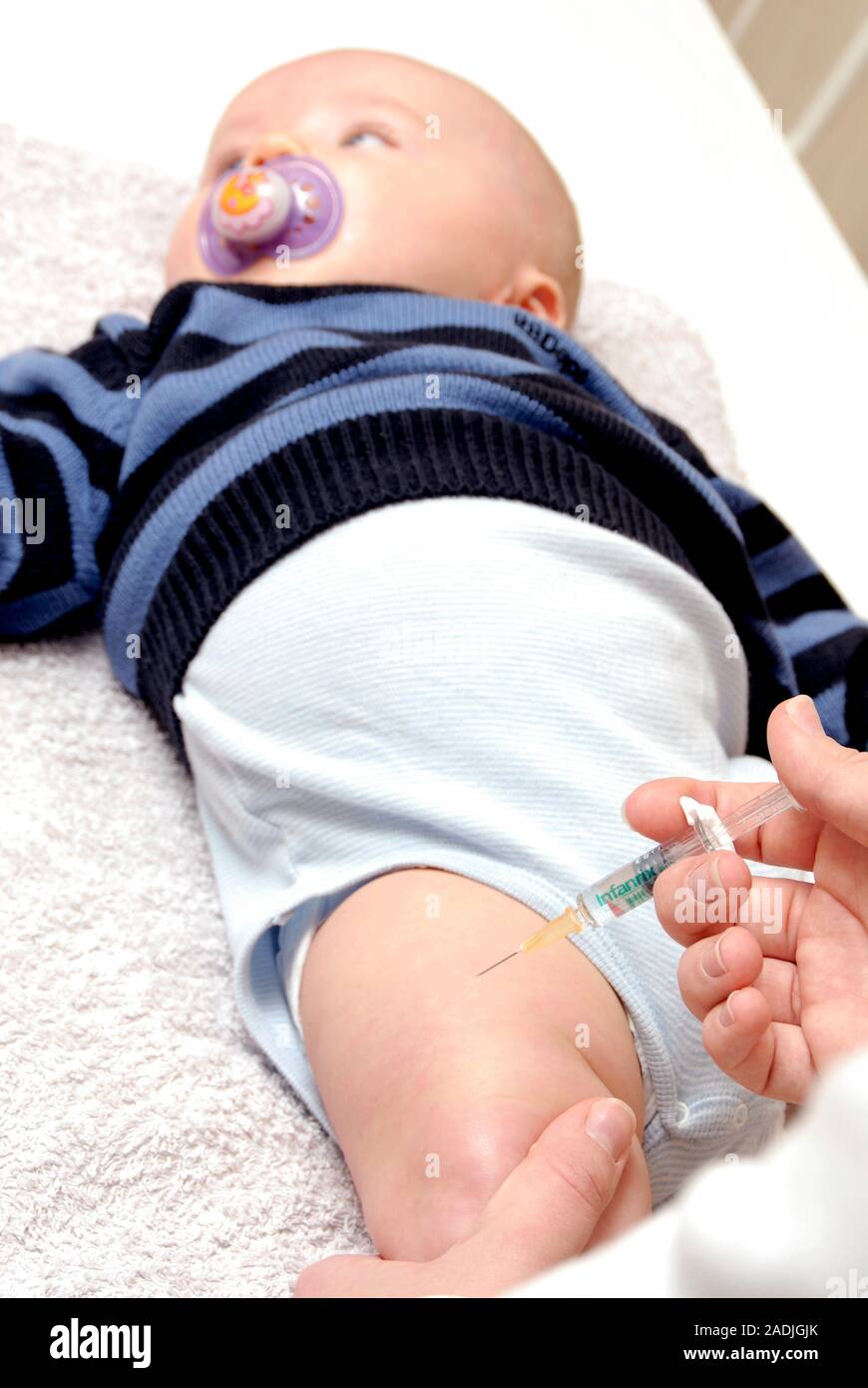 MODEL RELEASED. Vaccination. Baby receiving an injection Stock Photo ...