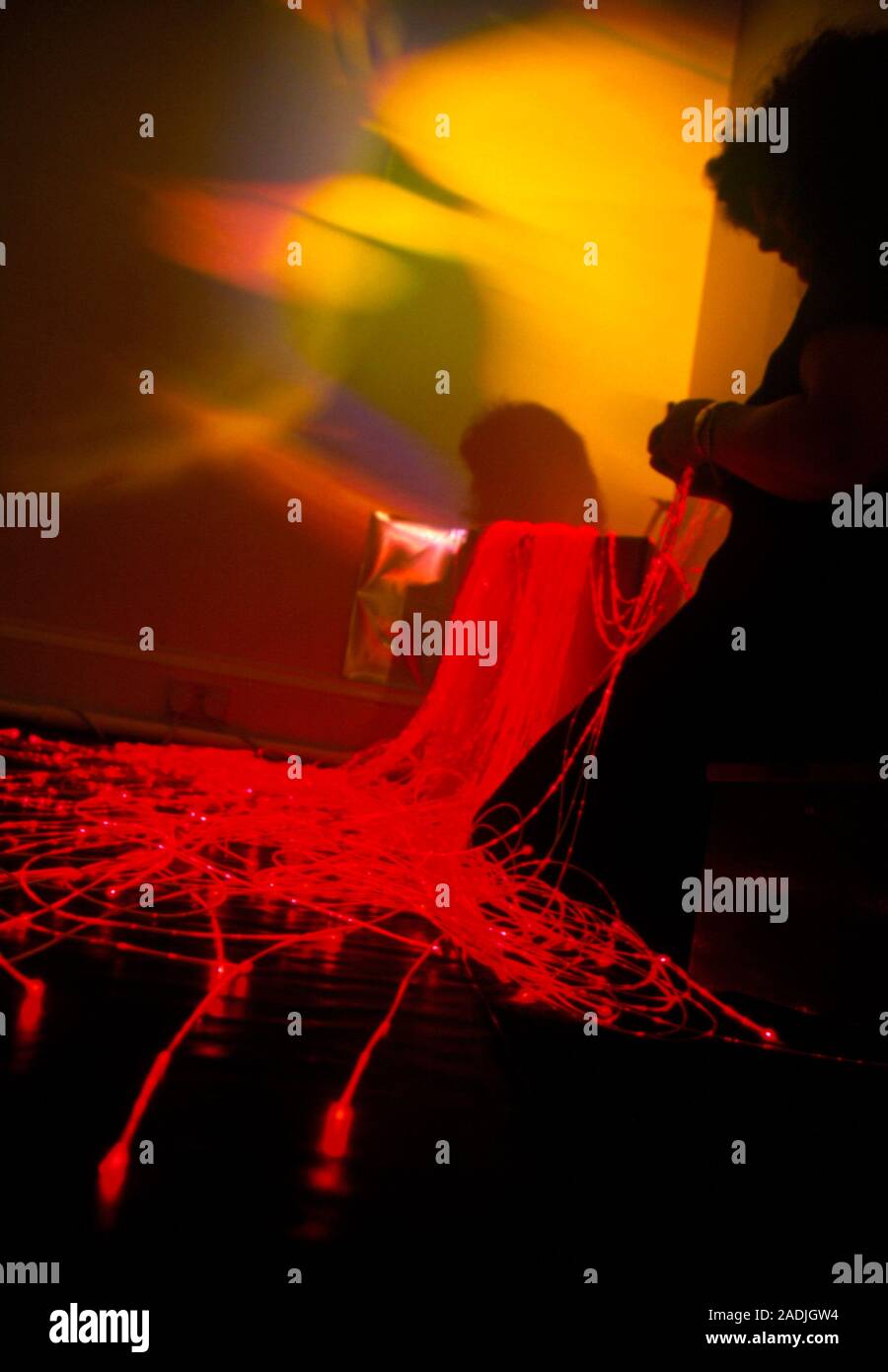 Occupational therapy. Hospital worker preparing strings of lights for ...