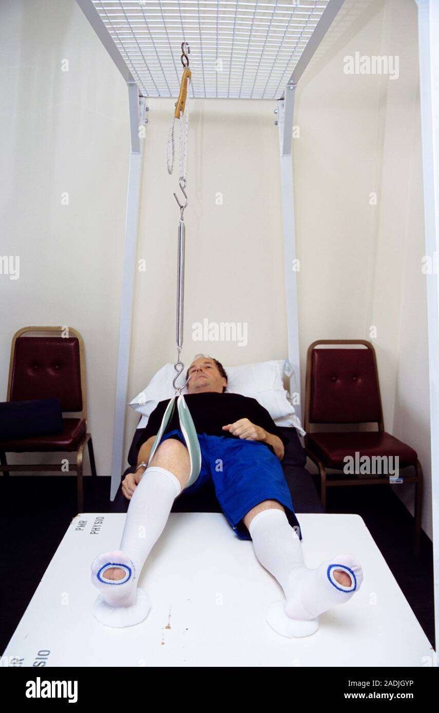 MODEL RELEASED. Physiotherapy. Patient undergoing physiotherapy after a ...