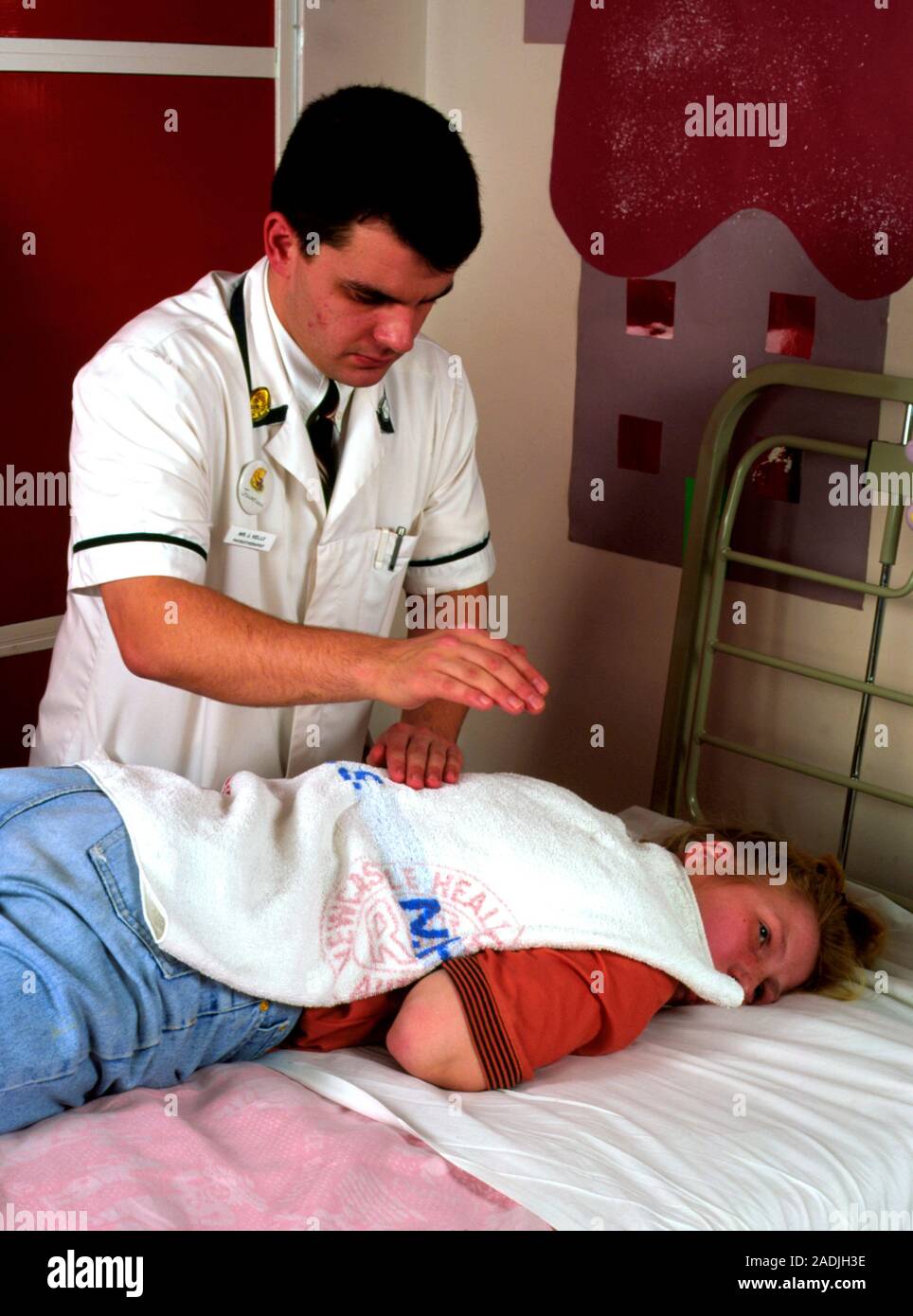 Cystic fibrosis patient receiving physiotherapy: massage-type ...