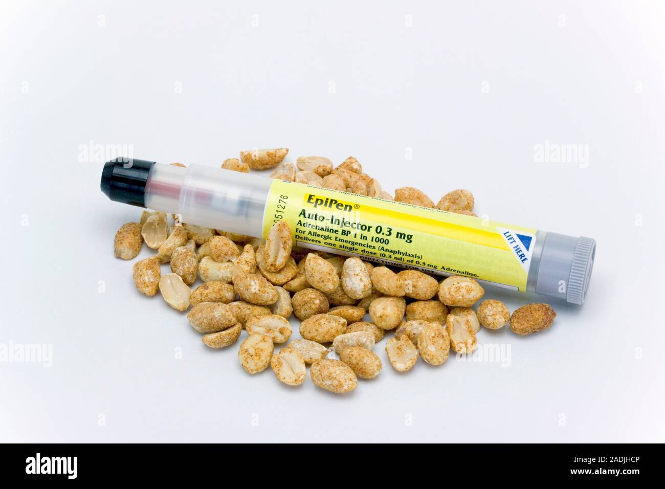 EpiPen and peanuts. EpiPen adrenaline syringe used for the emergency ...
