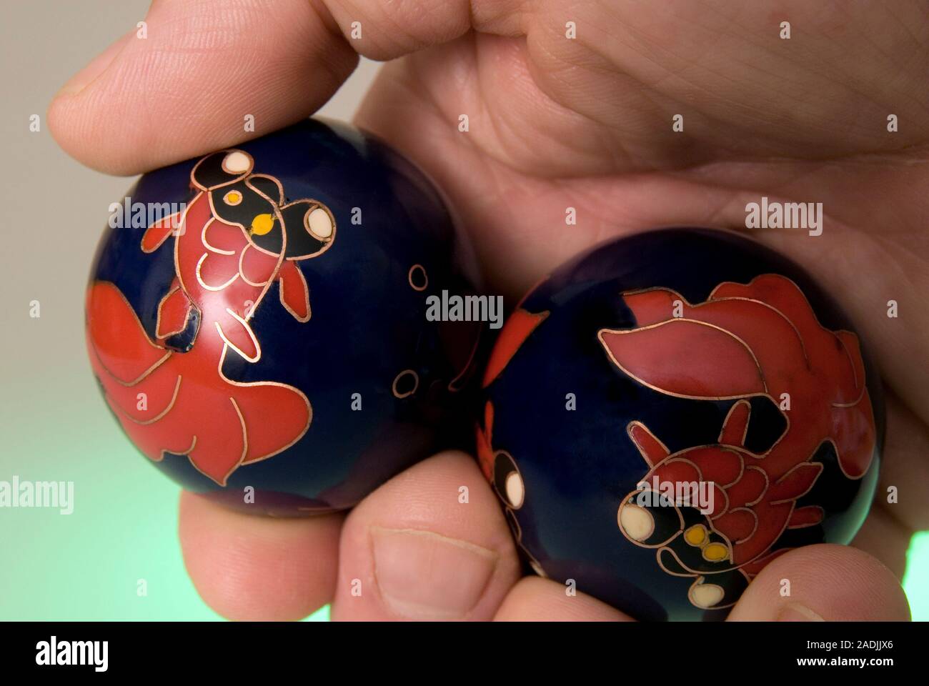 Stress balls in a man's hand. Stress balls are squeezed or rolled ...