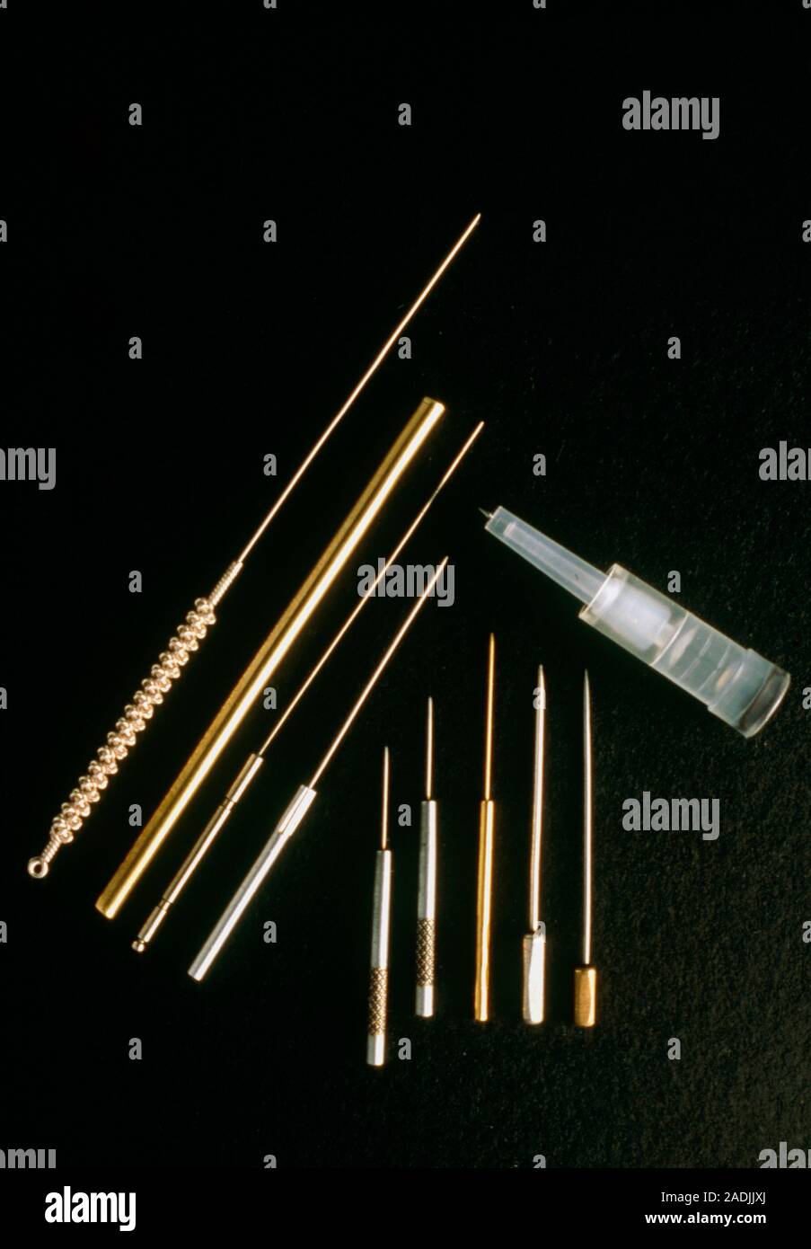 Assortment of acupuncture needles. The long needle at left is a ...