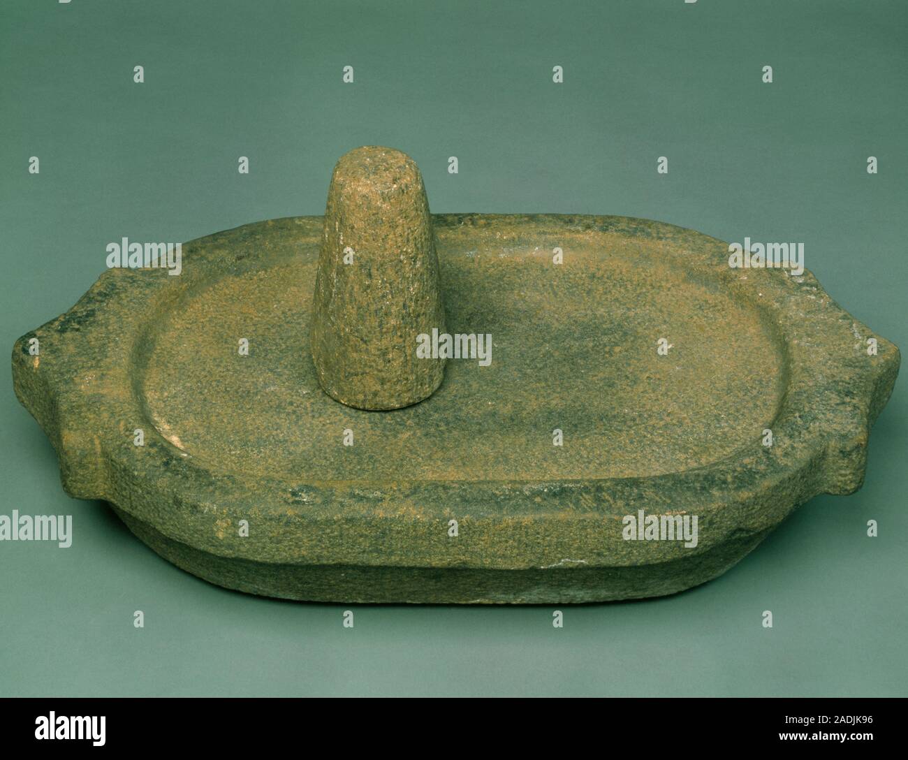 Herbal medicine grinder. Stone grinder consisting of a hand-held block ...