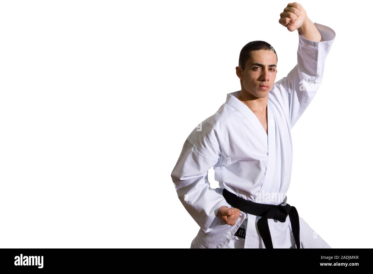 MODEL RELEASED. Karate. Karate practitioner standing with one arm ...