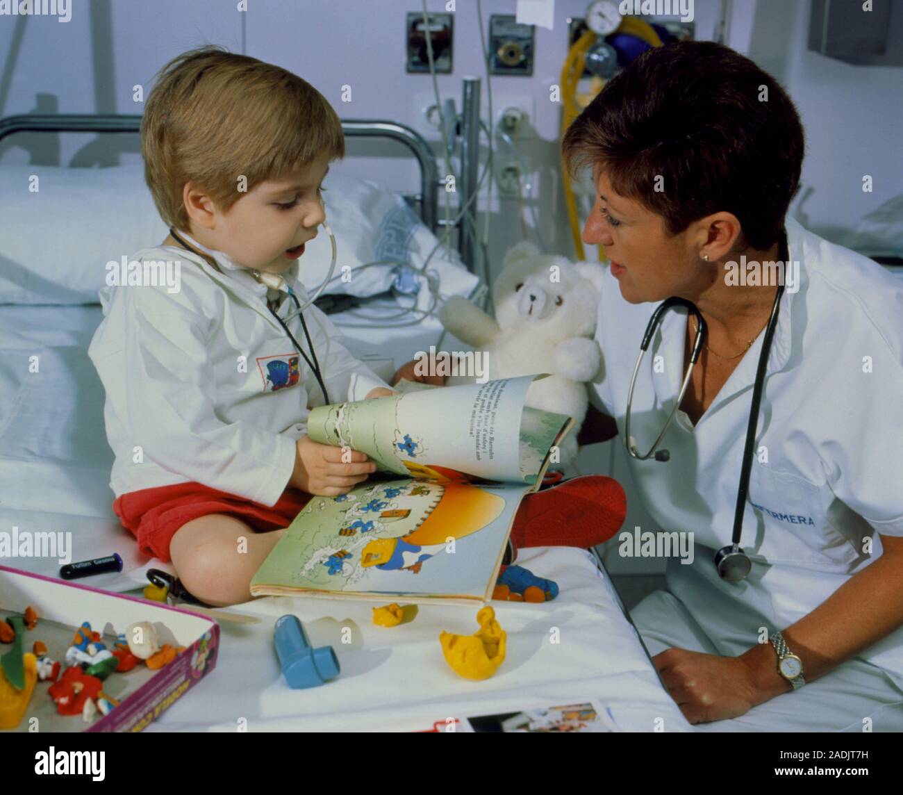 Ondine's curse. A nurse talks to a young child in hospital with the ...