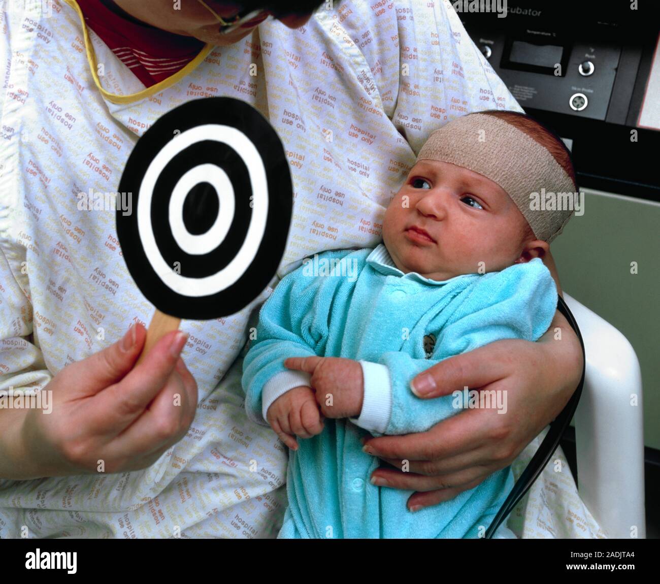 Monitoring baby's brain. Measure- ment of a baby's brain activity using ...