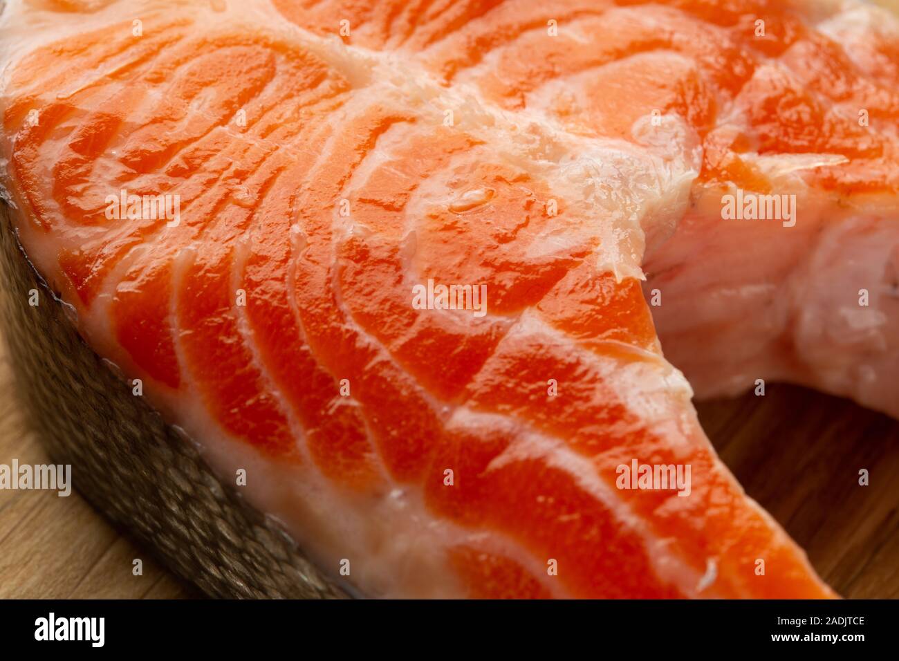 Wet raw red fish close up image Stock Photo - Alamy