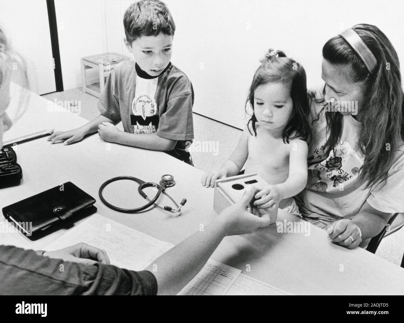 Cognitive development test. View of a female paediatrician testing a ...