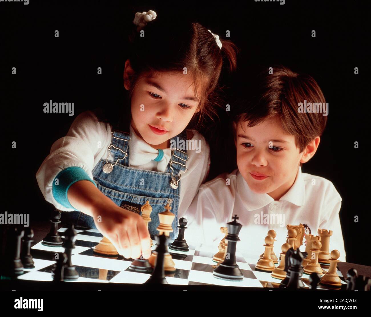 Chess. Girl and boy playing chess Stock Photo - Alamy
