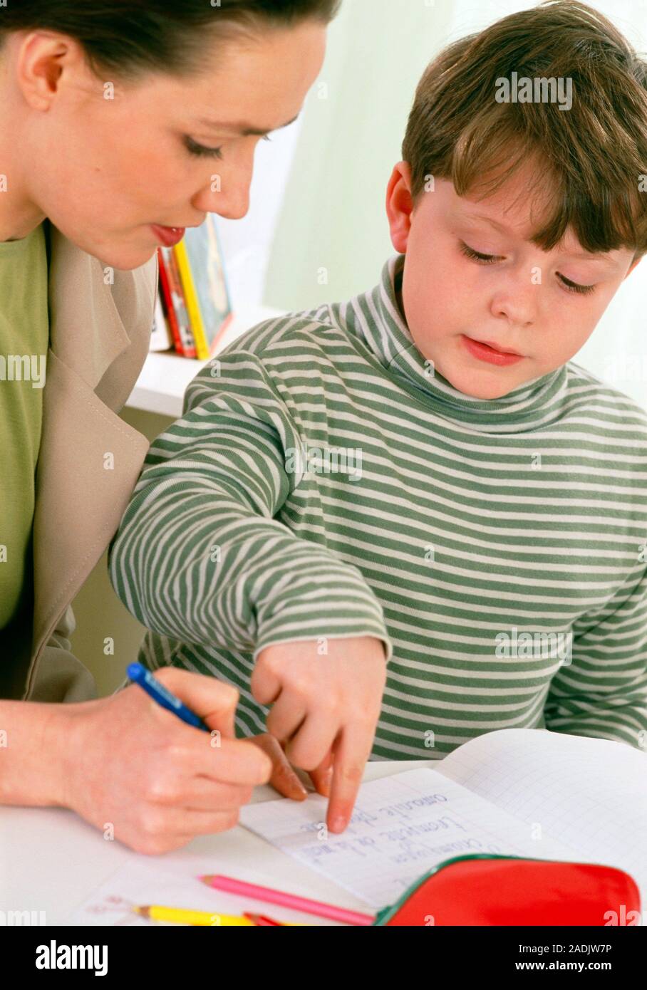 Mother and child studying Stock Photo - Alamy