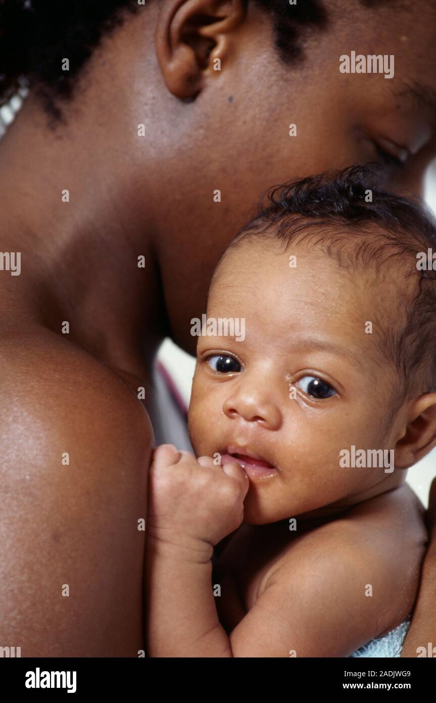 Mother and baby. Mother holding her 1-month-old baby daughter Stock ...