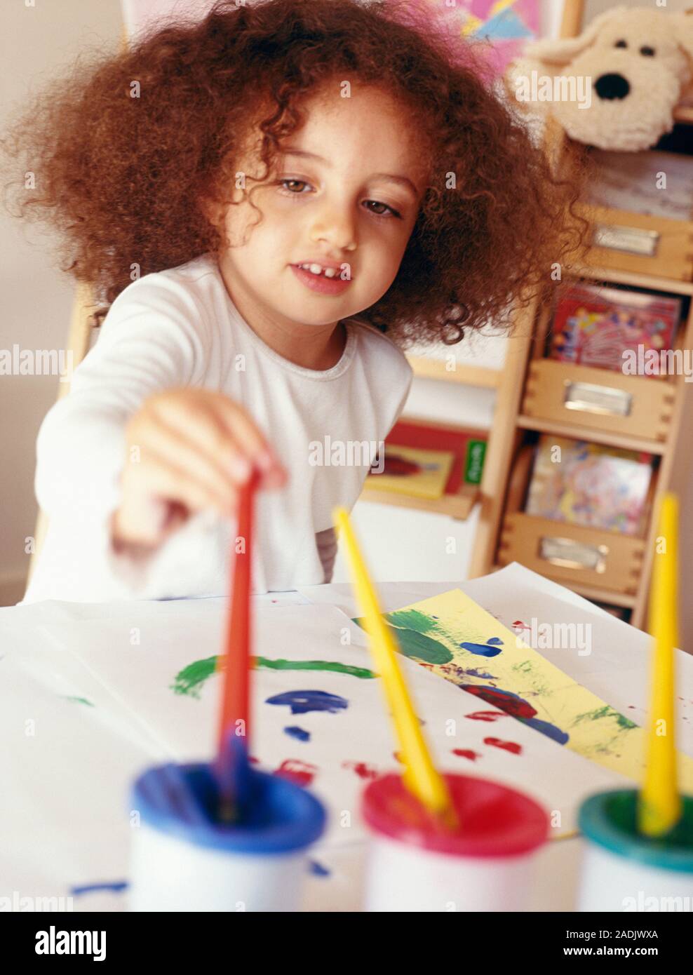 MODEL RELEASED. Girl painting. Three year old girl painting Stock Photo ...
