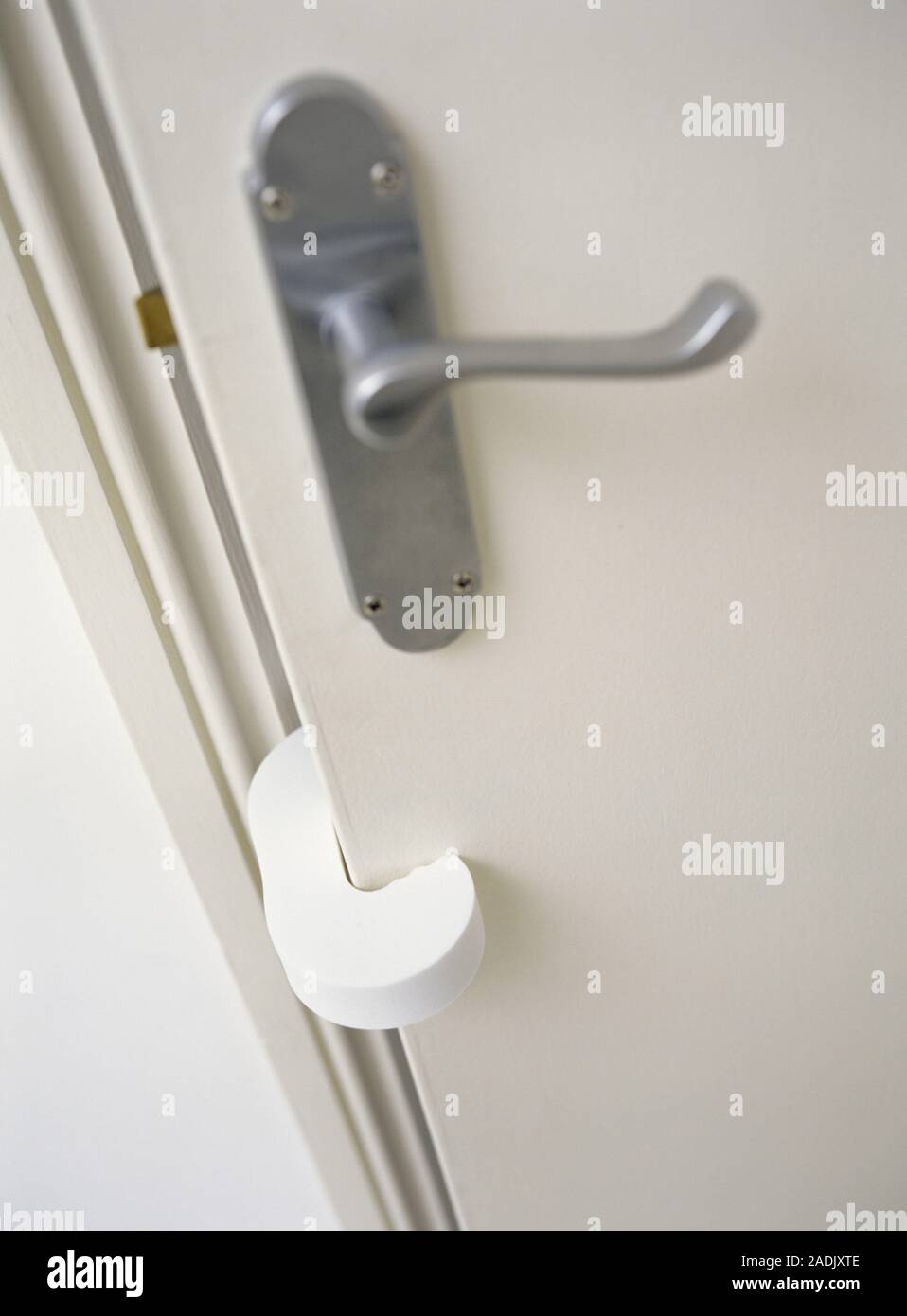 Child safety. Door catcher placed on edge of a door. This will stop the ...