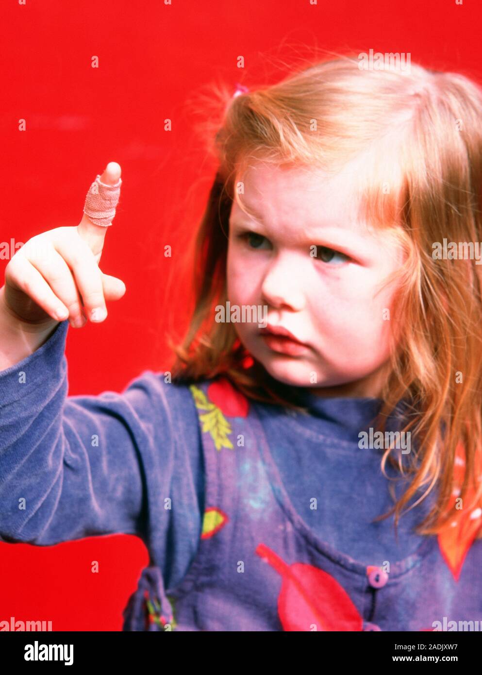 Plaster on the injured finger of a three year old girl. The plaster ...