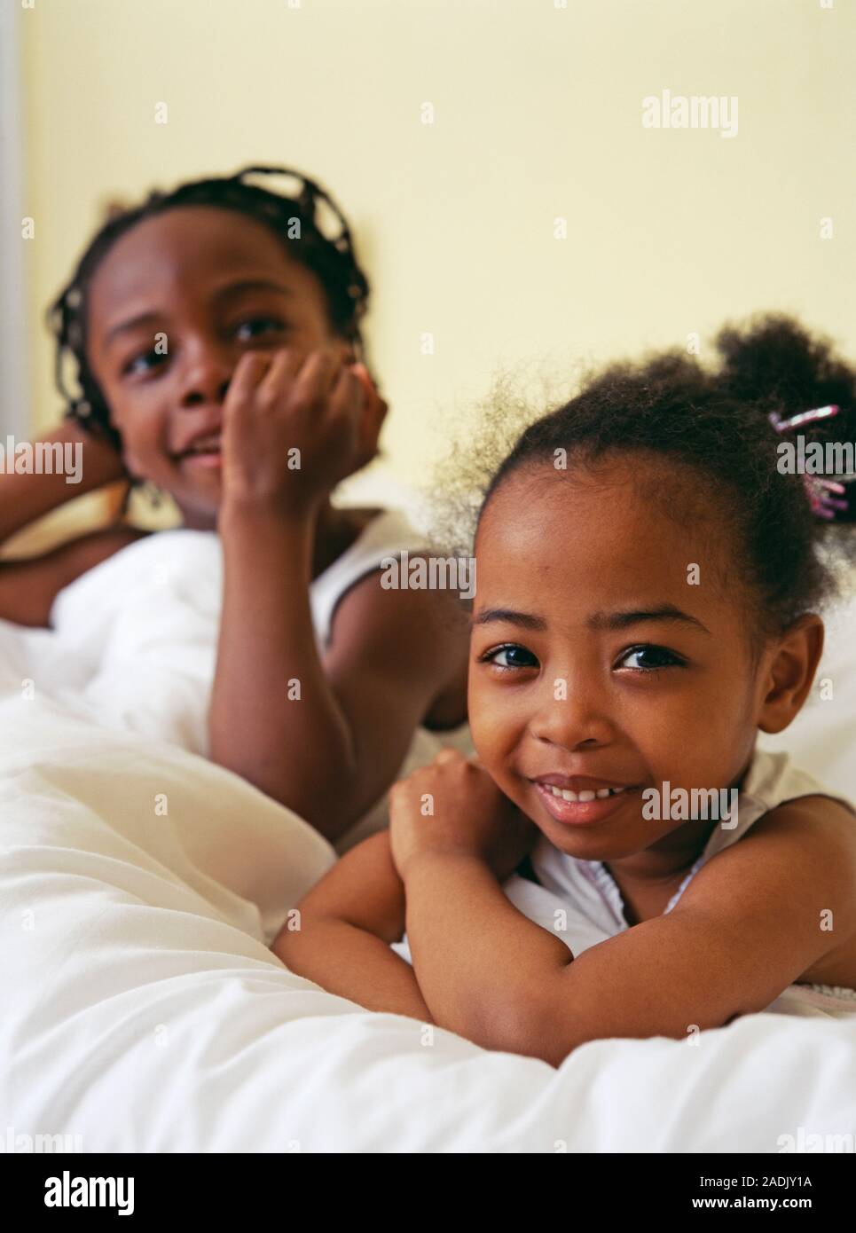 Feverish children. Four-year-old girl (foreground) and her five-year ...