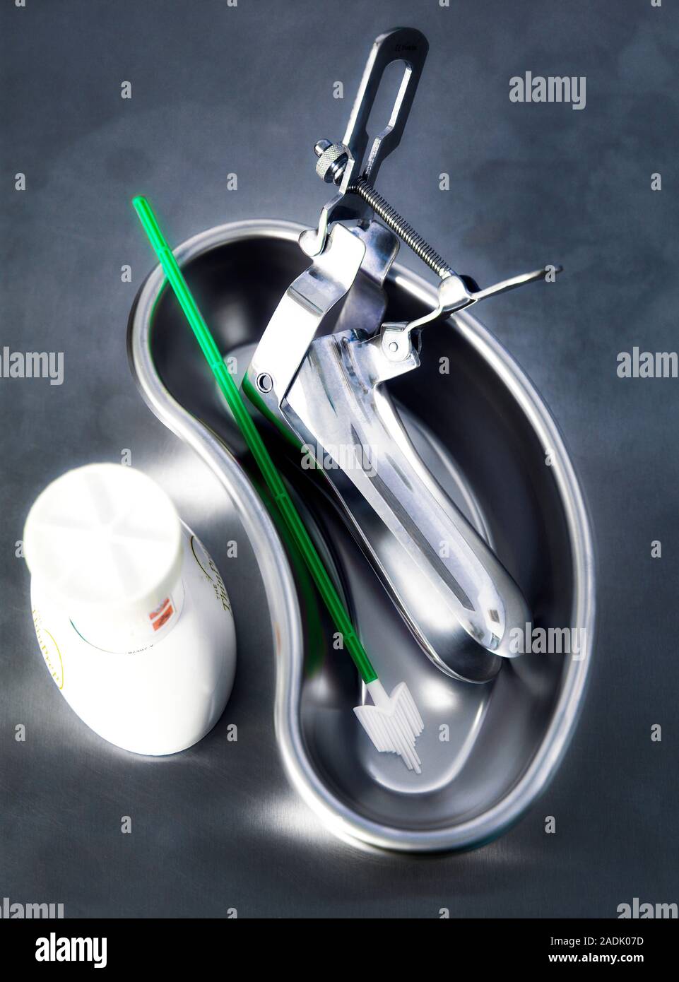 Smear test equipment. Duck-billed speculum and cytobrush in a kidney ...