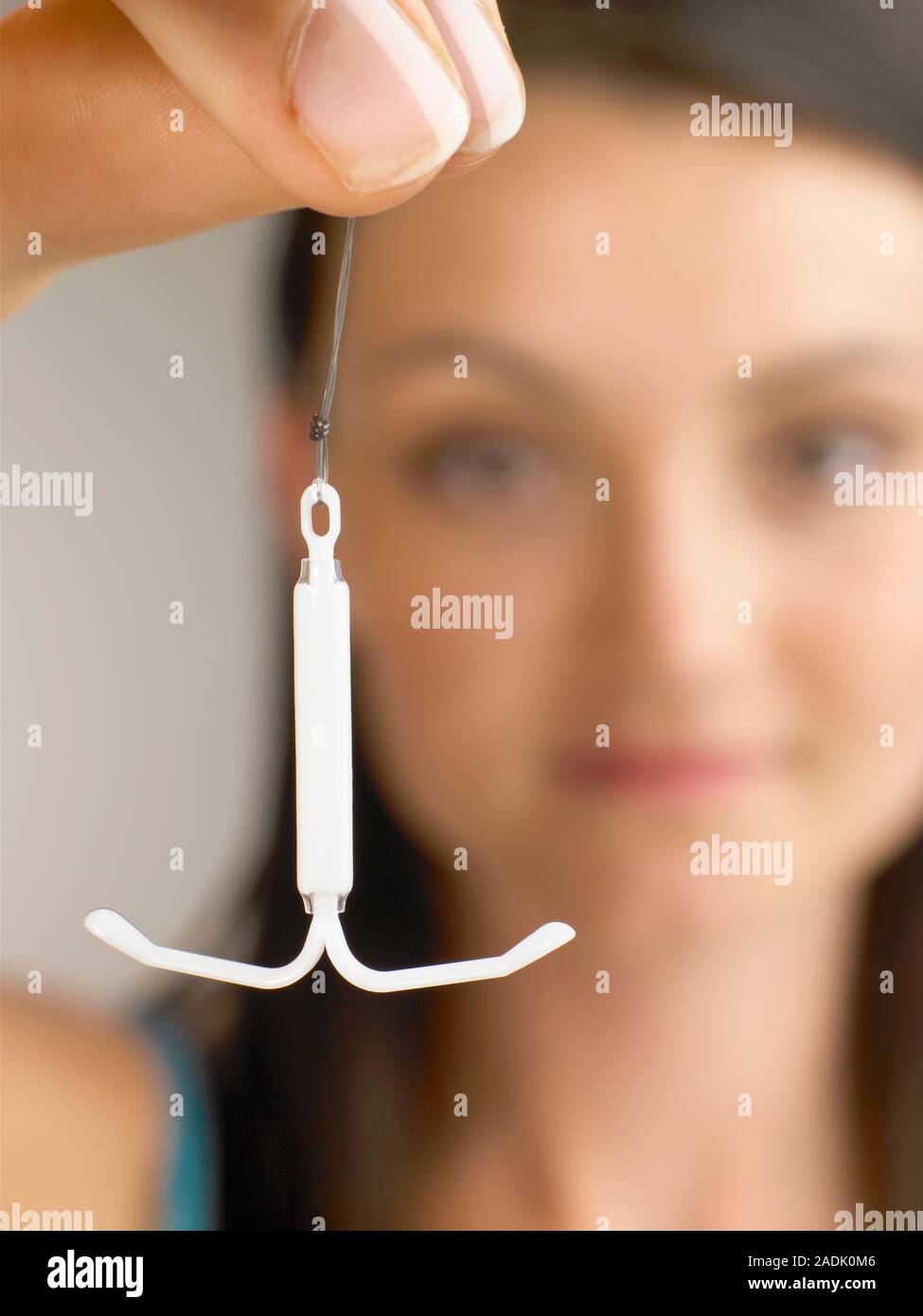 Mirena IUD contraceptive being held by a woman. This intrauterine ...