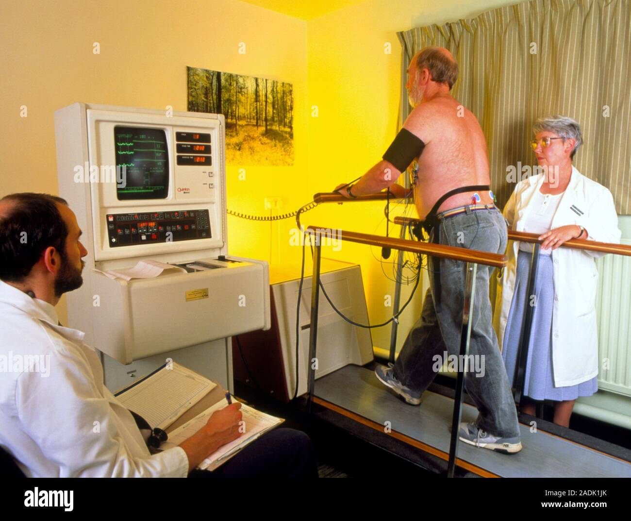 Man undergoing exercise testing on a treadmill, whilst an ...