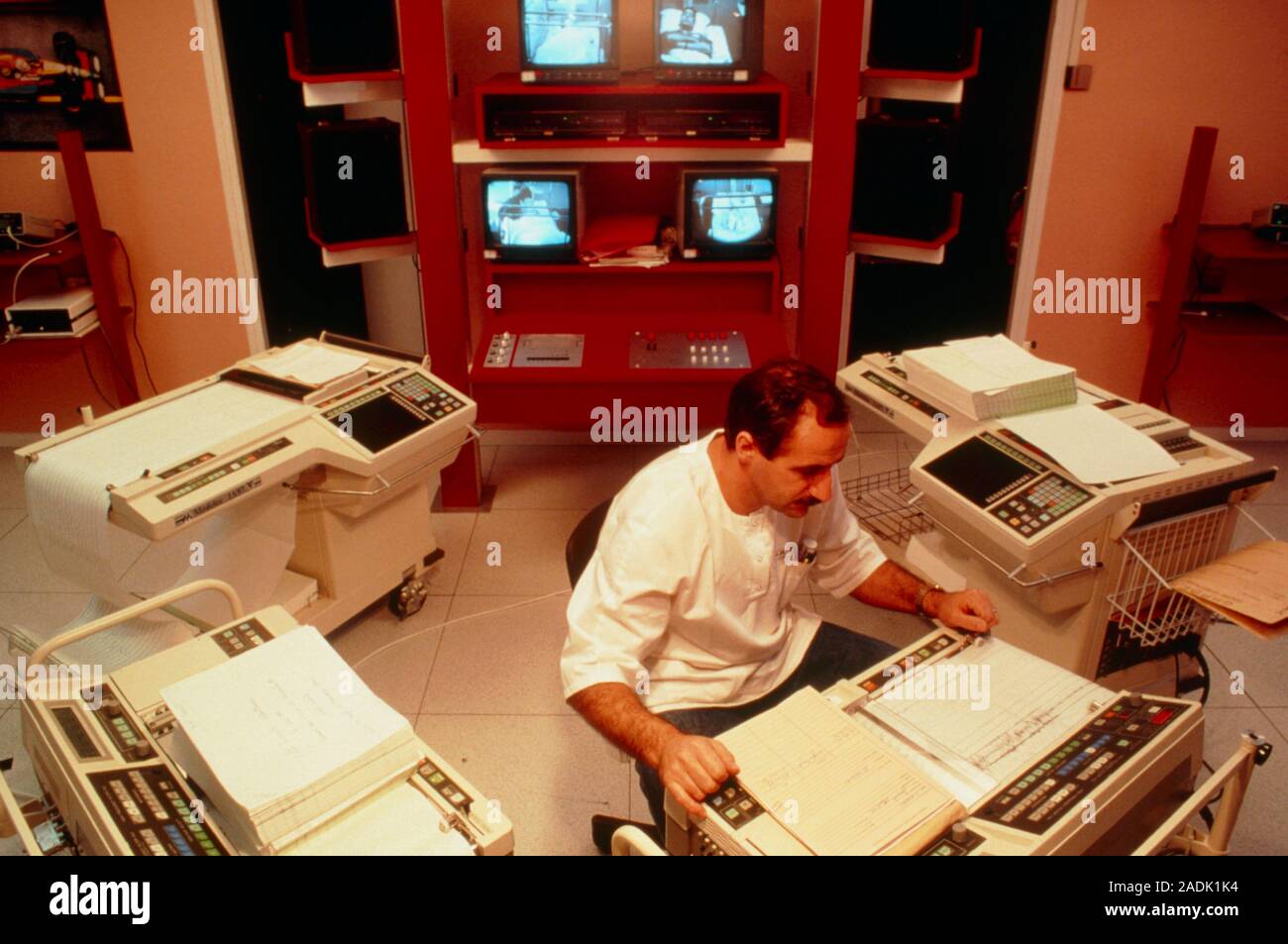 Sleep research: scientist studying a print-out in the control room of ...