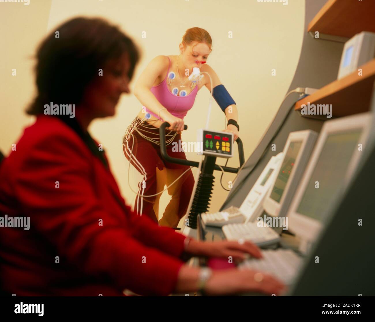 Fitness test. Woman taking a cardiovascular fitness test on an exercise ...