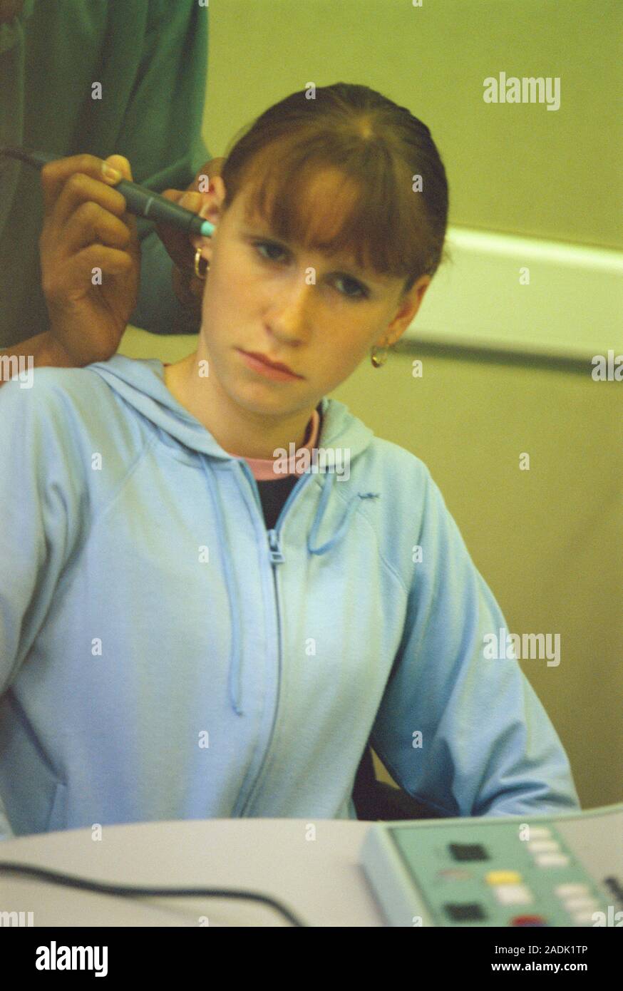 Tympanometry examination. Teenage girl having tympanometry to measure ...